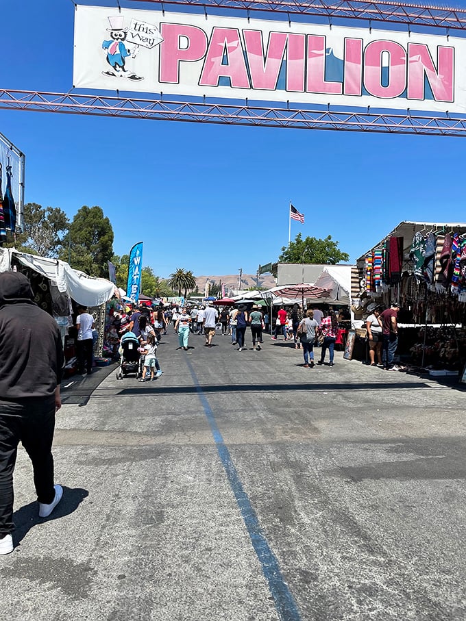 The Pavilion entrance beckons shoppers into its realm of retail therapy. Blue skies above, bargains below—a perfect California shopping equation.