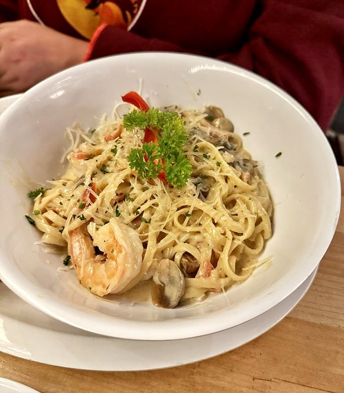 Seafood pasta that makes you wonder why anyone would ever eat plain noodles again – those plump shrimp are practically waving hello.