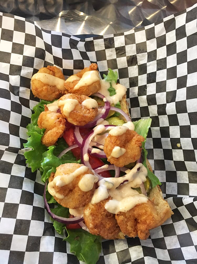 A po' boy that's rich in flavor. Crispy shrimp, fresh veggies, and sauce that drips down your arm—the hallmark of any sandwich worth eating.