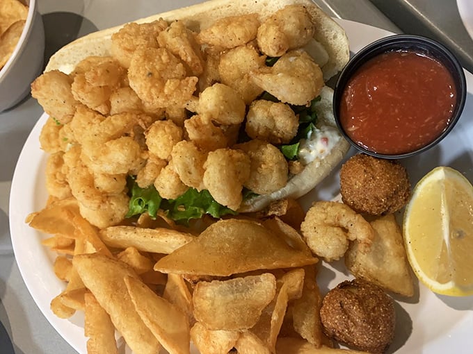 The Shrimp Po' Boy – where crispy crustaceans meet fresh veggies in a handheld masterpiece that would make New Orleans proud but with a distinctly Florida accent.