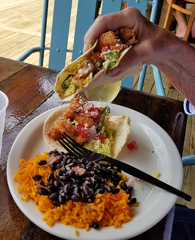 The moment when a perfectly fried shrimp taco meets fresh pico and black beans—it's the culinary equivalent of finding a perfect parking spot at the beach.