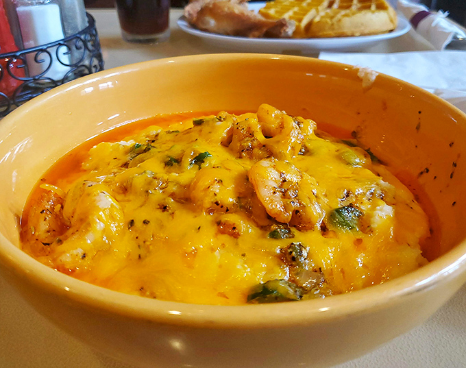 Shrimp and grits that would make Charleston jealous. That cheese pull isn't just for show—it's the promise of creamy, savory perfection.