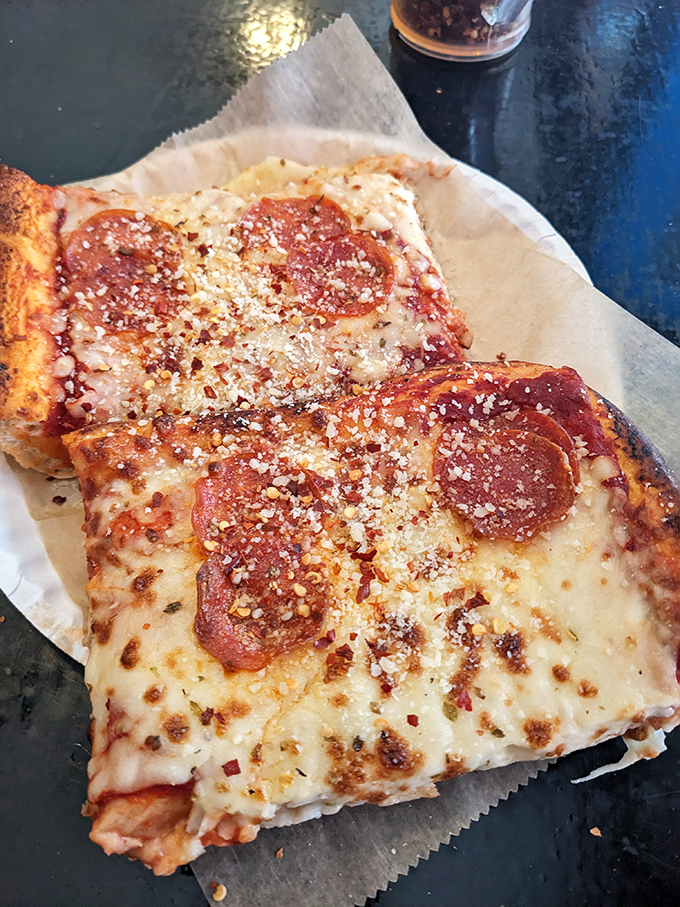 The two-slice special – where college budgets meet gourmet satisfaction. Add a cold drink and you've got nirvana.
