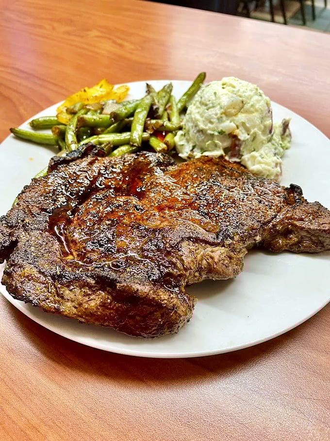 Steakhouses charging triple couldn't improve on this perfectly seared sirloin. The potato salad and green beans aren't sidekicks—they're essential supporting characters in this meaty drama.
