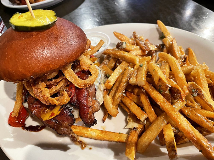 Behold the burger that launched a thousand road trips. Those golden fries aren't just sides—they're supporting actors deserving their own Oscar.