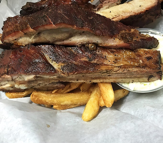 These ribs aren't falling off the bone—and that's exactly right. The perfect resistance gives way to smoky pork paradise with just the right tug.