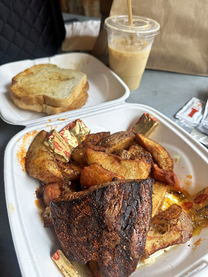 Steak and eggs: the breakfast of champions, cowboys, and anyone with good taste. Those potatoes aren't just a side—they're a crispy, seasoned statement of purpose.
