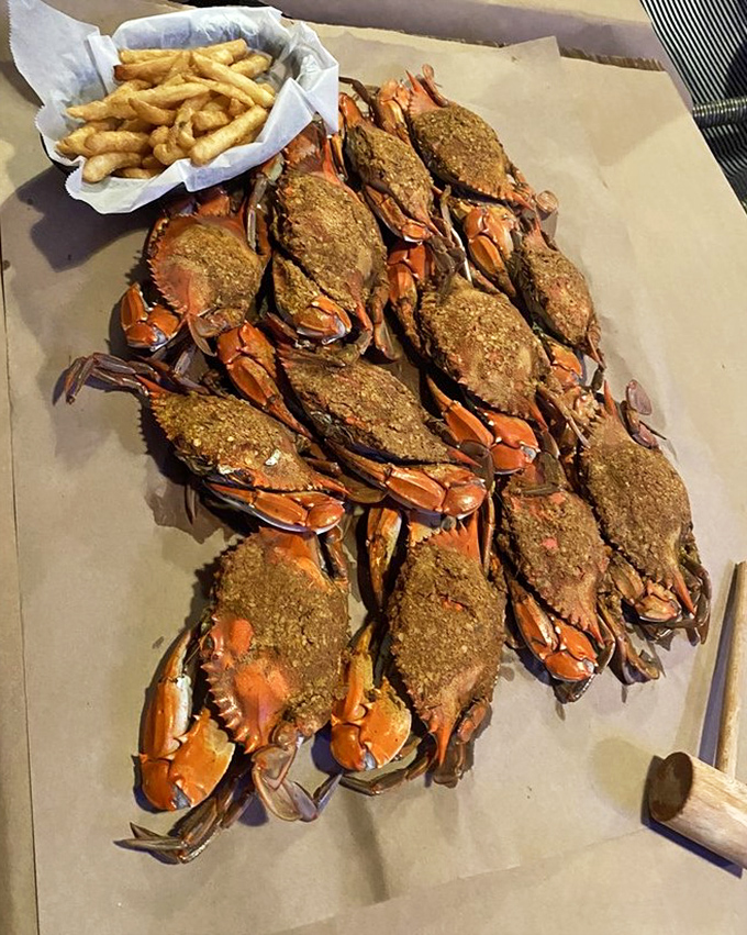 Seafood doesn't get more authentic than this—seasoned blue crabs piled high with fries, requiring both hands and zero inhibitions.