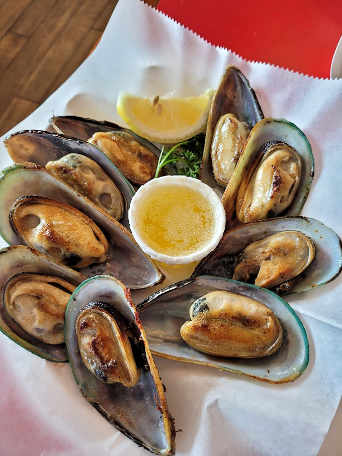 These mussels aren't just opened, they're revealing themselves to you—plump, glistening, and ready for their butter bath close-up.