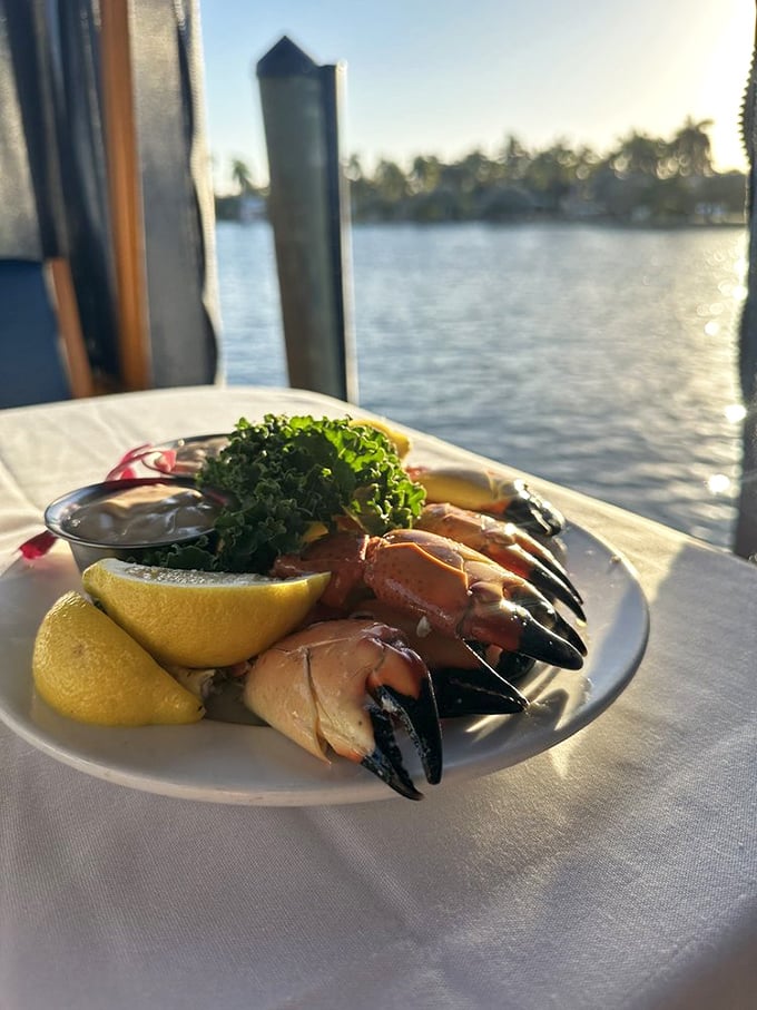 Stone crab claws served with lemon wedges—nature's perfect design meets culinary simplicity in a dish worth traveling miles for.