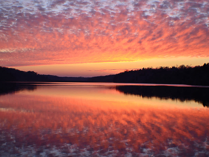 Sunset paints the sky in shades that would make Bob Ross reach for colors he hadn't invented yet – nature's perfect backdrop to Galena's natural beauty.