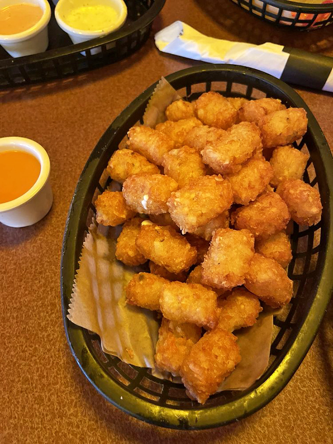 Golden-brown tater tot perfection that would make Napoleon Dynamite weep with joy. Crispy outside, fluffy inside—the way the potato gods intended.