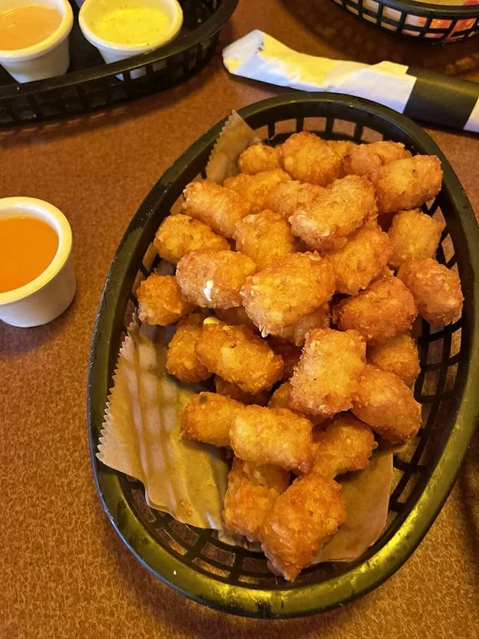 Golden-brown tater tot perfection that would make Napoleon Dynamite weep with joy. Crispy outside, fluffy inside—the way the potato gods intended.