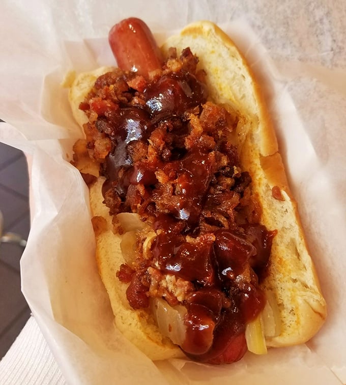 Bacon and BBQ sauce transform an ordinary hot dog into something worth crossing state lines for – no passport required.
