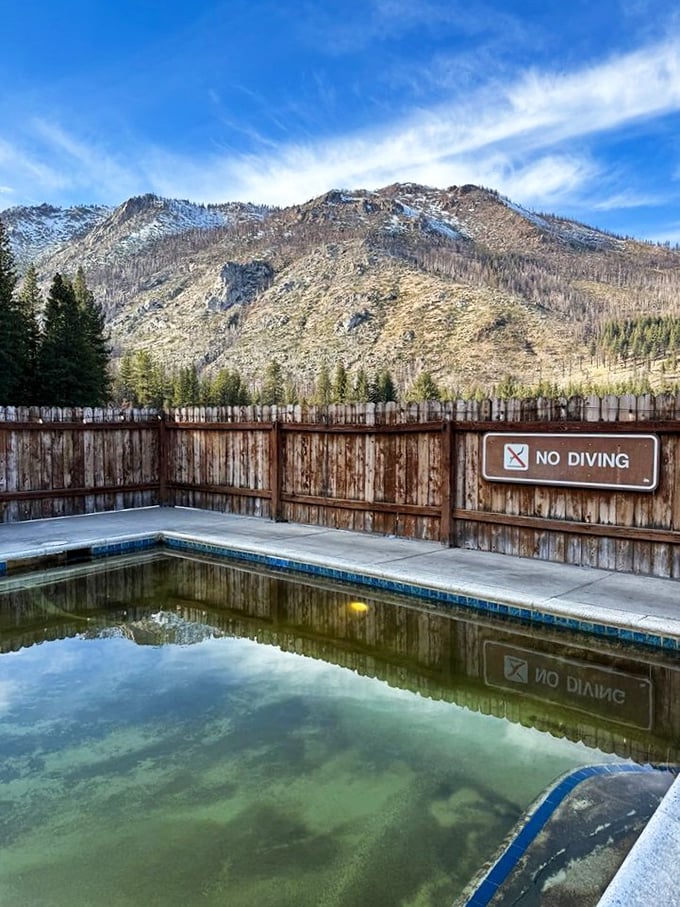 "No diving" seems unnecessary when the view is this distracting. The mineral pool reflects mountain majesty while promising therapeutic soaks for weary bodies.