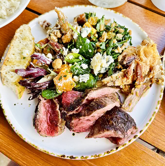 The tomahawk steak arrives like a prehistoric masterpiece, ready to transport you to carnivorous paradise.