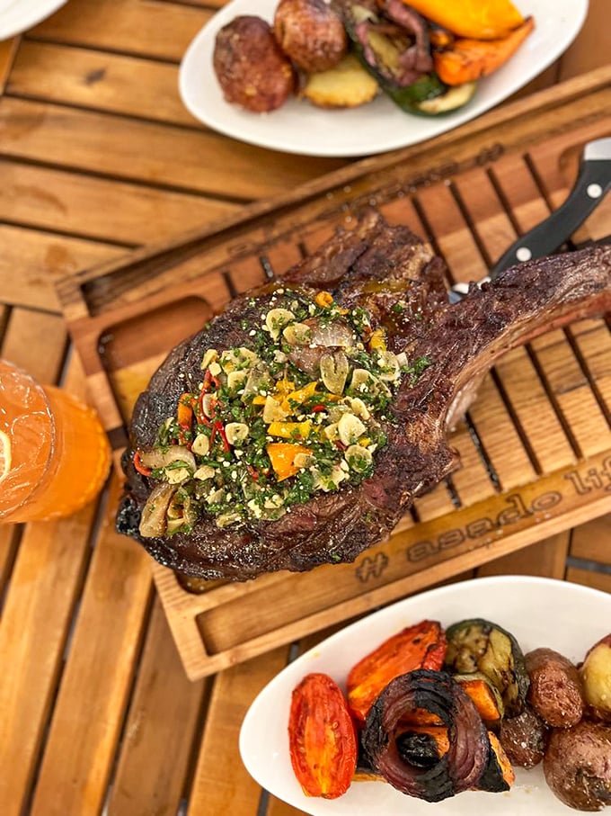 Behold the tomahawk steak: a prehistoric-looking cut that delivers flavors worthy of its intimidating appearance and hefty price tag.