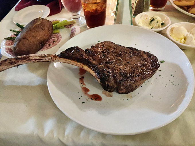 That bone-in ribeye isn't just a steak—it's prehistoric, primal satisfaction on a plate, with a handle nature thoughtfully provided. 