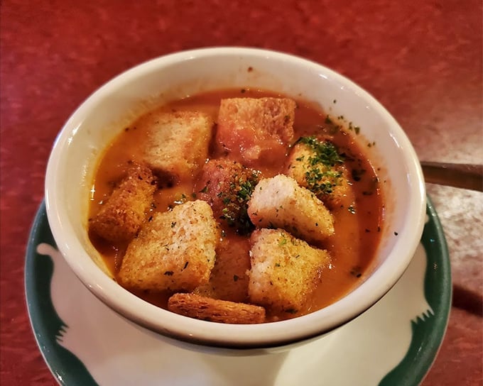 Tomato soup elevated from childhood memory to grown-up comfort. Those homemade croutons aren't just floating—they're doing the backstroke in tomato glory.