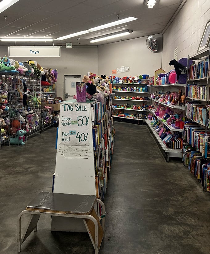 The toy section: where childhood memories are stacked floor to ceiling and board games with "mostly all the pieces" await family game nights.