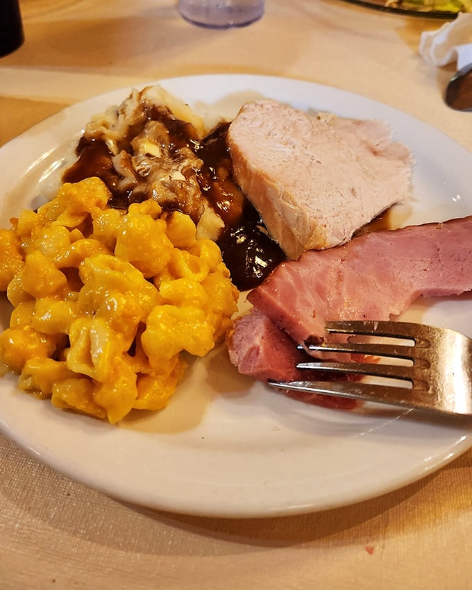 Turkey, ham, and mac and cheese – the holy trinity of comfort food that makes you wonder why you ever bothered with fancy restaurants.