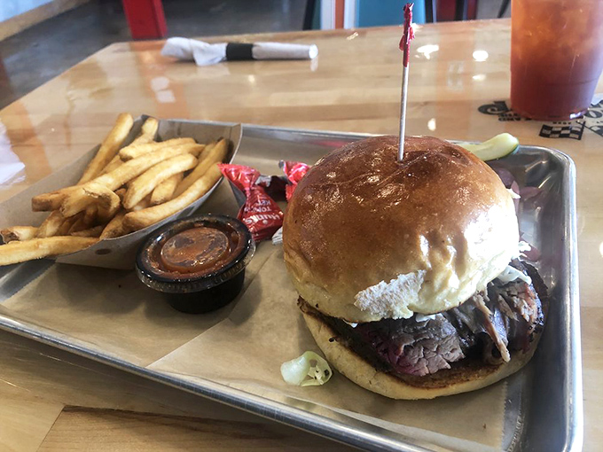 The brisket sandwich—where smoke-kissed beef meets pillowy bun in a relationship your taste buds will want to third-wheel.