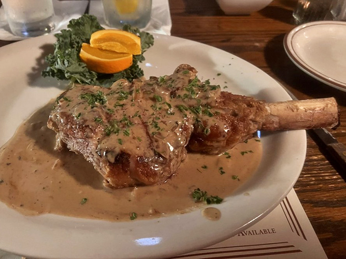 This veal chop isn't just dinner—it's a statement piece. Swimming in sauce that you'll be tempted to drink directly from the plate when nobody's looking. 