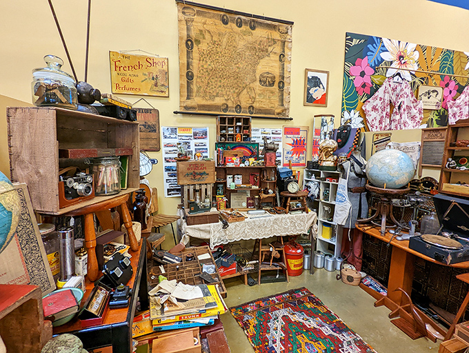 This delightfully chaotic vendor space is what happens when history refuses to be neatly categorized. That vintage map on the wall has guided someone's adventures long before GPS existed.