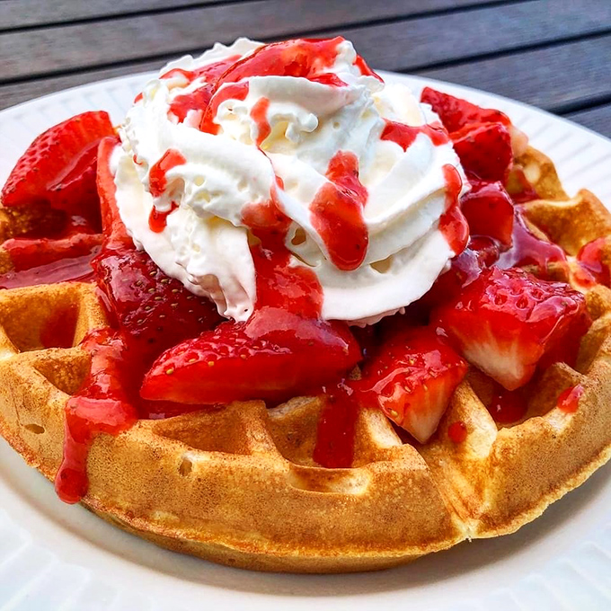 A Belgian waffle that's dressed for success. Those strawberries aren't just a topping—they're jewelry for this breakfast masterpiece.