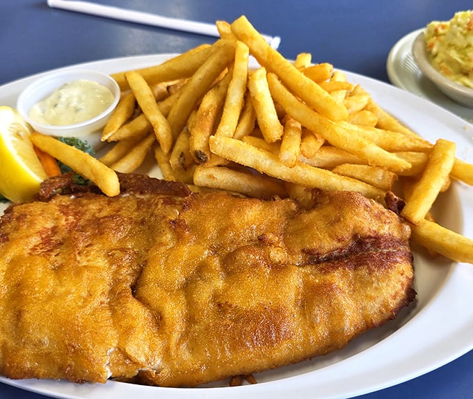 Golden-fried walleye that's worth crossing the Mackinac Bridge for—crispy exterior giving way to flaky perfection that practically melts on contact.