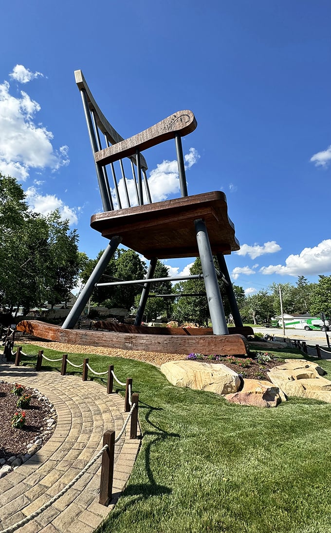 The chair's massive wooden slats and steel reinforcements aren't just for show—this is serious engineering with a wink.
