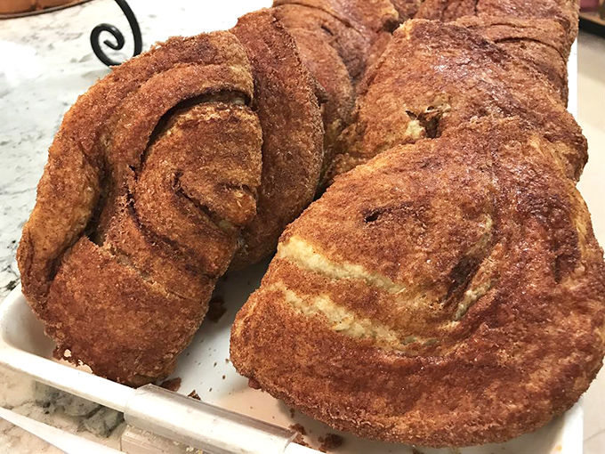 Apple flips that would make your grandmother weep with joy – golden pastry spirals hiding sweet, cinnamon-kissed fruit treasures within.