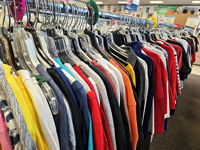 A rainbow of possibilities hanging neatly by color—like a wardrobe consultant organized everything just for your shopping pleasure.