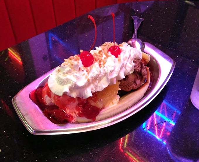 Dessert nirvana arrives in boat form—this banana split has more peaks and valleys than a California coastal drive.