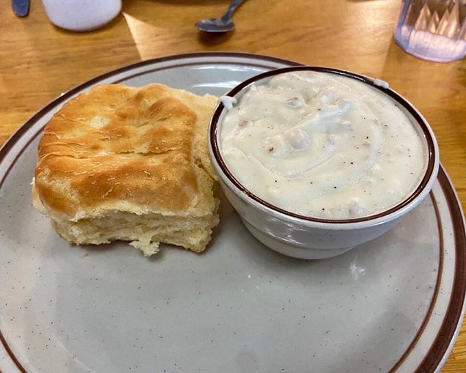 A proper biscuit and gravy should require no knife—just a willing fork and a grateful heart. This one passes the test beautifully.