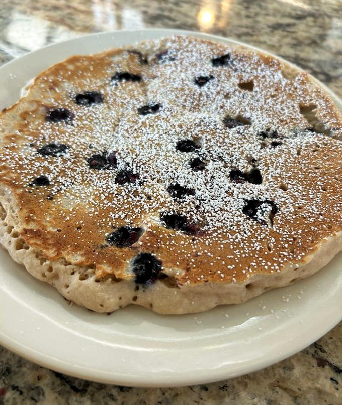 This blueberry pancake isn't just breakfast, it's edible poetry—fluffy, sweet, and dotted with fruit jewels that burst with each bite.