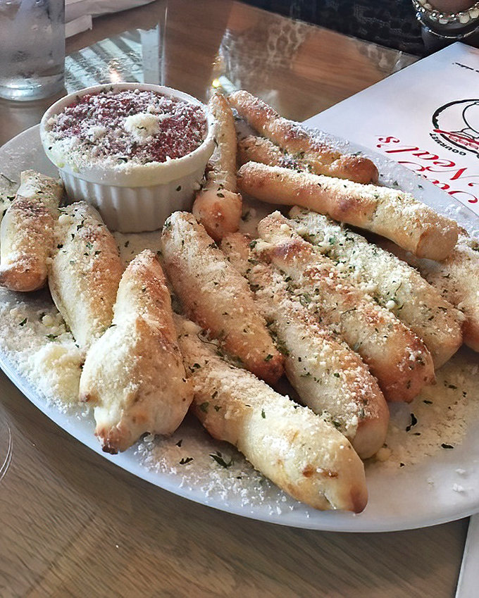 Breadsticks that could make a carb-counter weep with joy, dusted with enough garlic and cheese to keep vampires away for weeks.