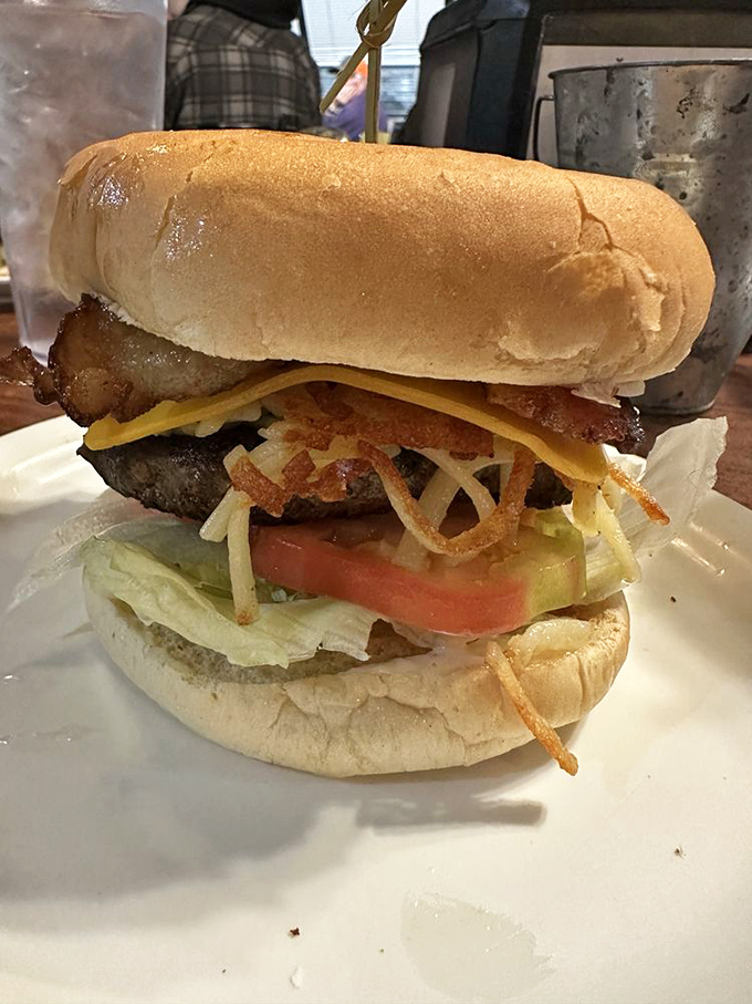 Behold the architecture of a proper diner burger—where each layer is structural engineering at its most delicious.