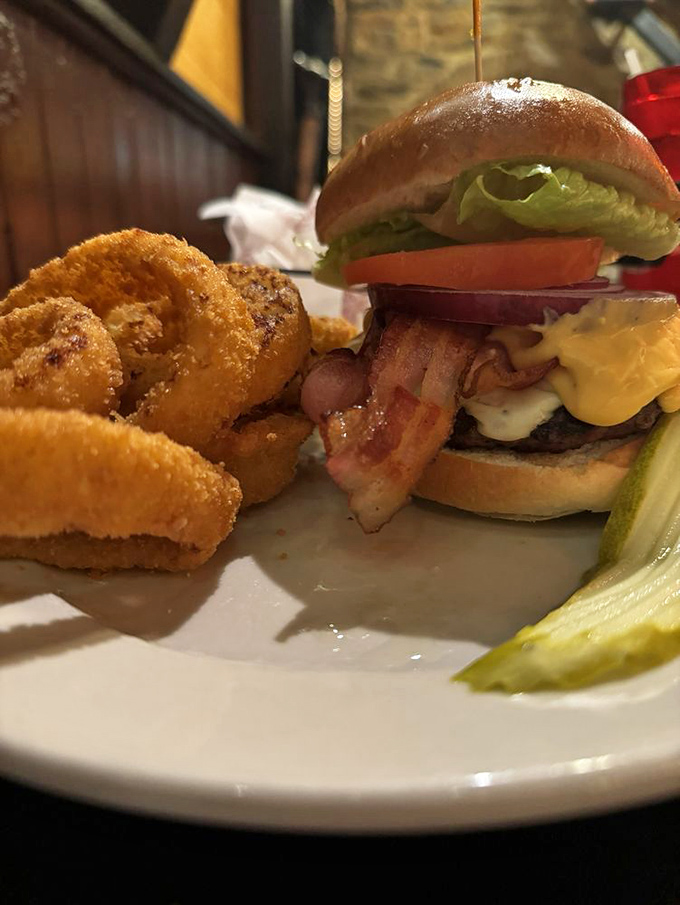 The burger that launched a thousand return visits. Those onion rings aren't just sides—they're golden halos of crispy perfection.