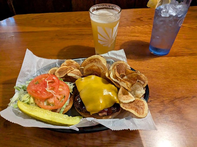Behold: the burger that launched a thousand road trips. That melty cheese blanket isn't just topping—it's tucking that perfect patty in for a nap it'll never take.