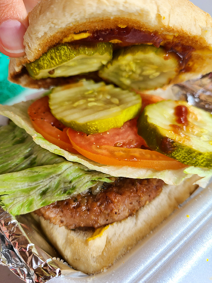 Layer upon glorious layer—this isn't just a sandwich, it's architecture. The pickle-to-tomato ratio would make Frank Lloyd Wright weep with joy.
