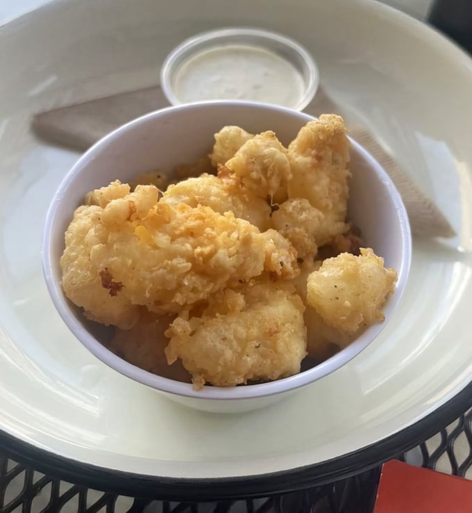These golden cheese curds aren't just fried – they're transformed. Wisconsin's finest export gets the Ohio treatment, and we're all winners.