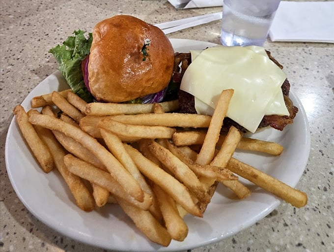 This isn't just a cheeseburger—it's a hand-held masterpiece of beef, cheese, and possibility, escorted by golden fries.