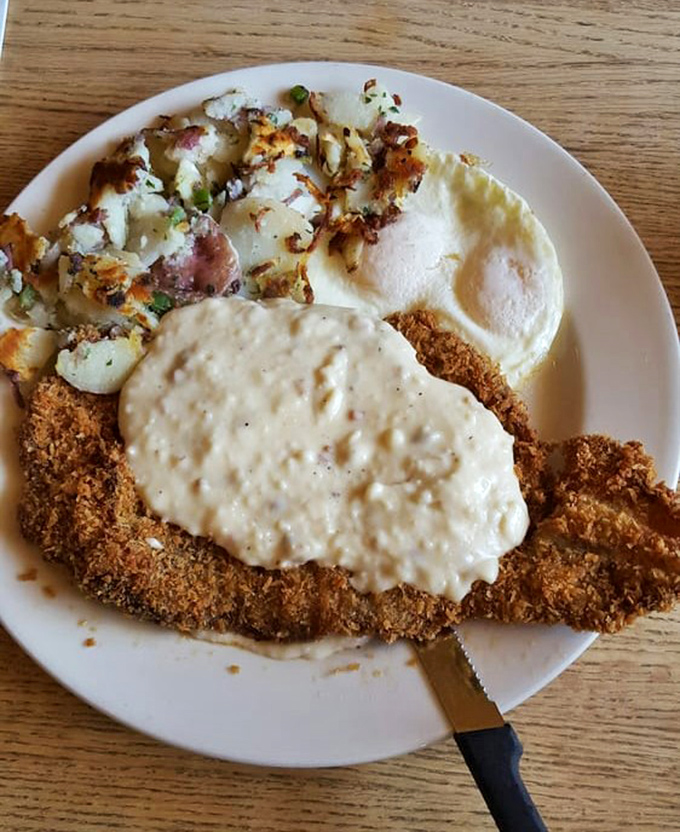 Country-fried steak smothered in gravy—where comfort food meets art form. The kind of meal your cardiologist warns you about but secretly craves.