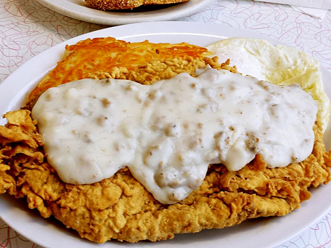 Chicken fried steak arrives like a golden-brown hug on a plate, smothered in gravy and good intentions.