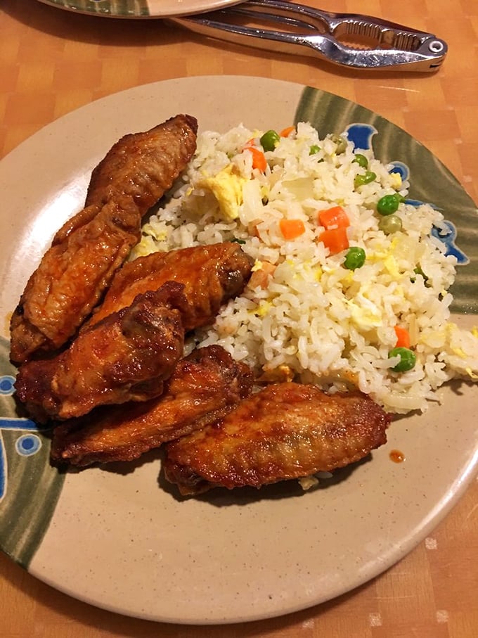 Crispy wings and perfectly cooked fried rice—the dynamic duo that makes you wonder why you ever bothered with delivery.