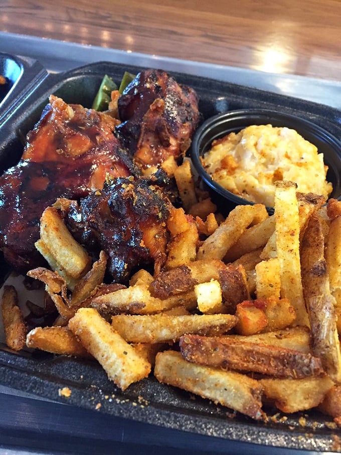 These ribs aren't just falling off the bone—they're practically volunteering to jump onto your plate alongside those perfectly golden fries.