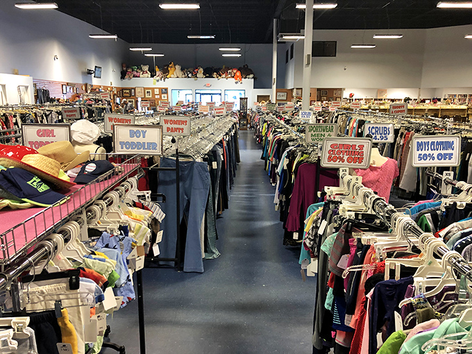 Clothing racks stretch toward the horizon like a textile Grand Canyon. Each aisle offers a different expedition into fashion's past and present.