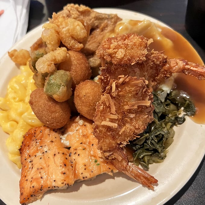 A plate that tells a delicious story—crispy coconut shrimp, perfectly grilled salmon, and sides that don't know they're supposed to be supporting characters.