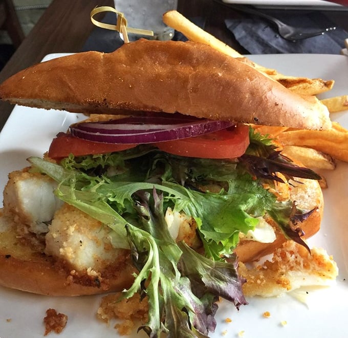 This fish sandwich doesn't need to shout to get your attention. Crispy, fresh, and perfectly balanced with greens and tomato—comfort food elevated.